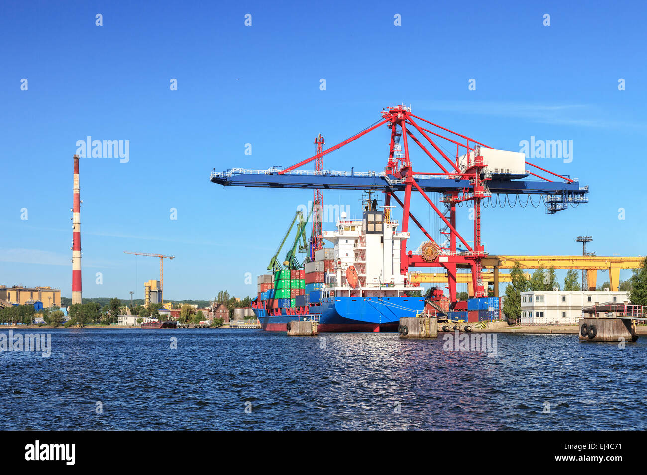 Large container ship in a dock at port of Gdansk, Poland Stock Photo ...