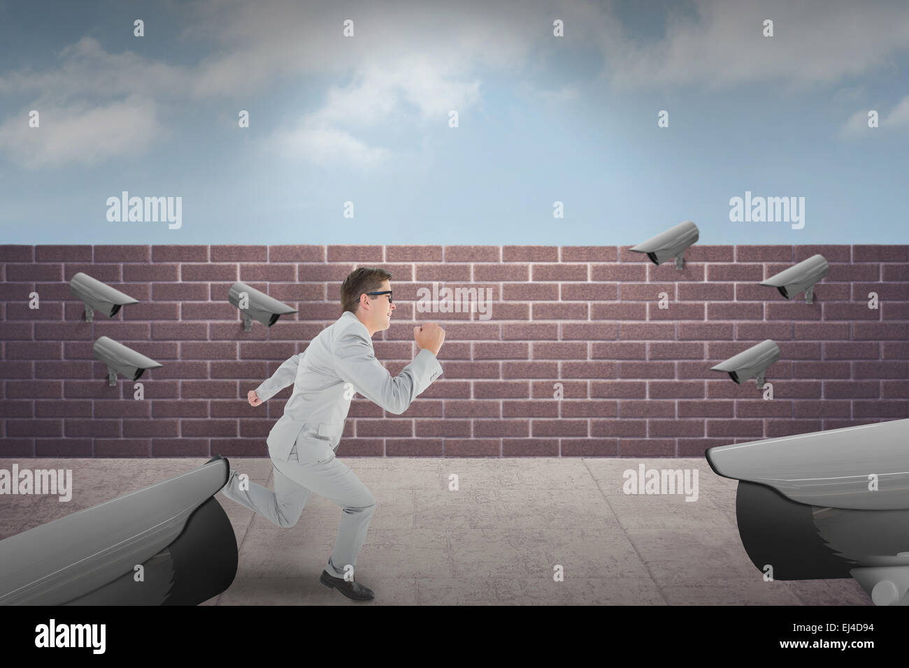 Composite image of geeky happy businessman running mid air Stock Photo ...