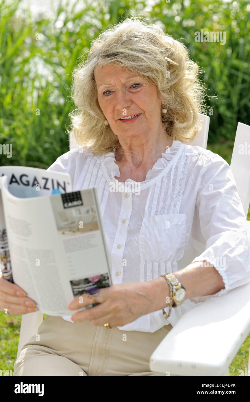 Reading a magazine hi-res stock photography and images - Alamy