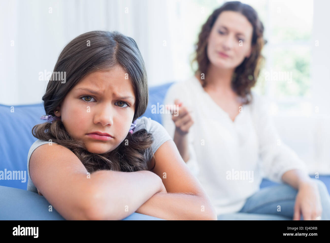 Upset mother looking at her daughter Stock Photo - Alamy