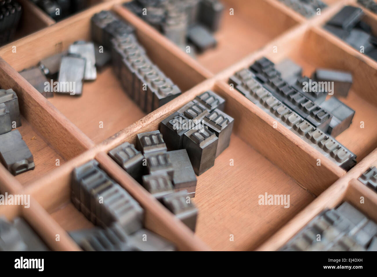 A wooden box containing type script letters - Typography Stock Photo ...