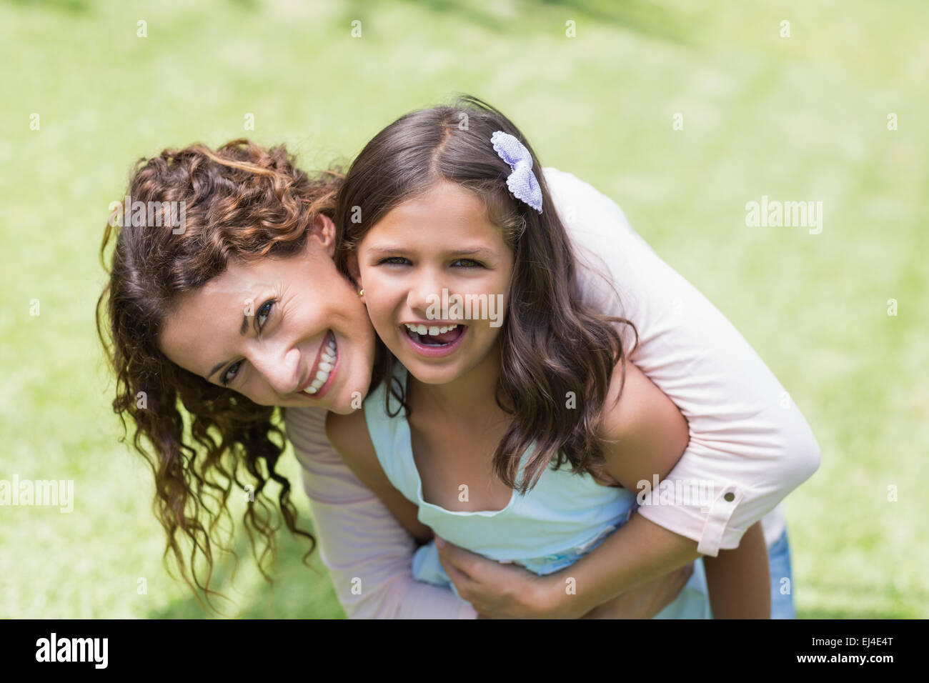 Happy mother and daughter hugging hi-res stock photography and images - Alamy