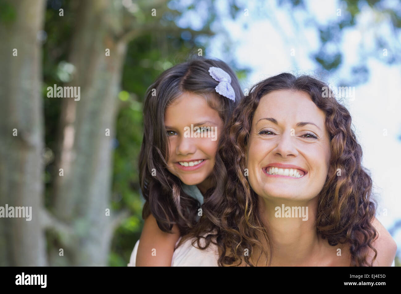 Happy mother and daughter embracing Stock Photo - Alamy
