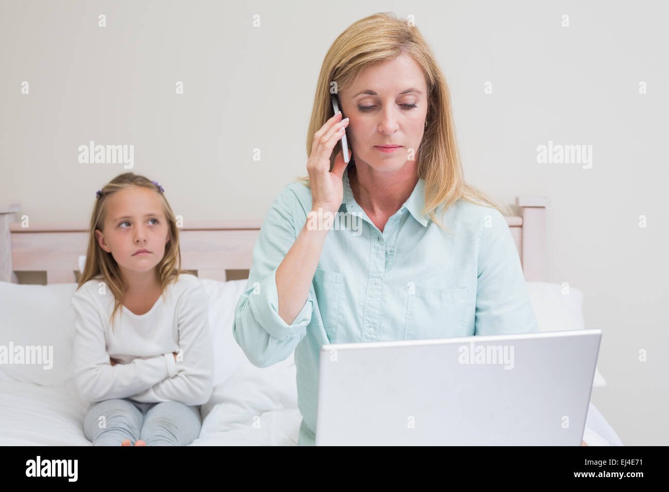 Mother ignoring her little girl Stock Photo - Alamy