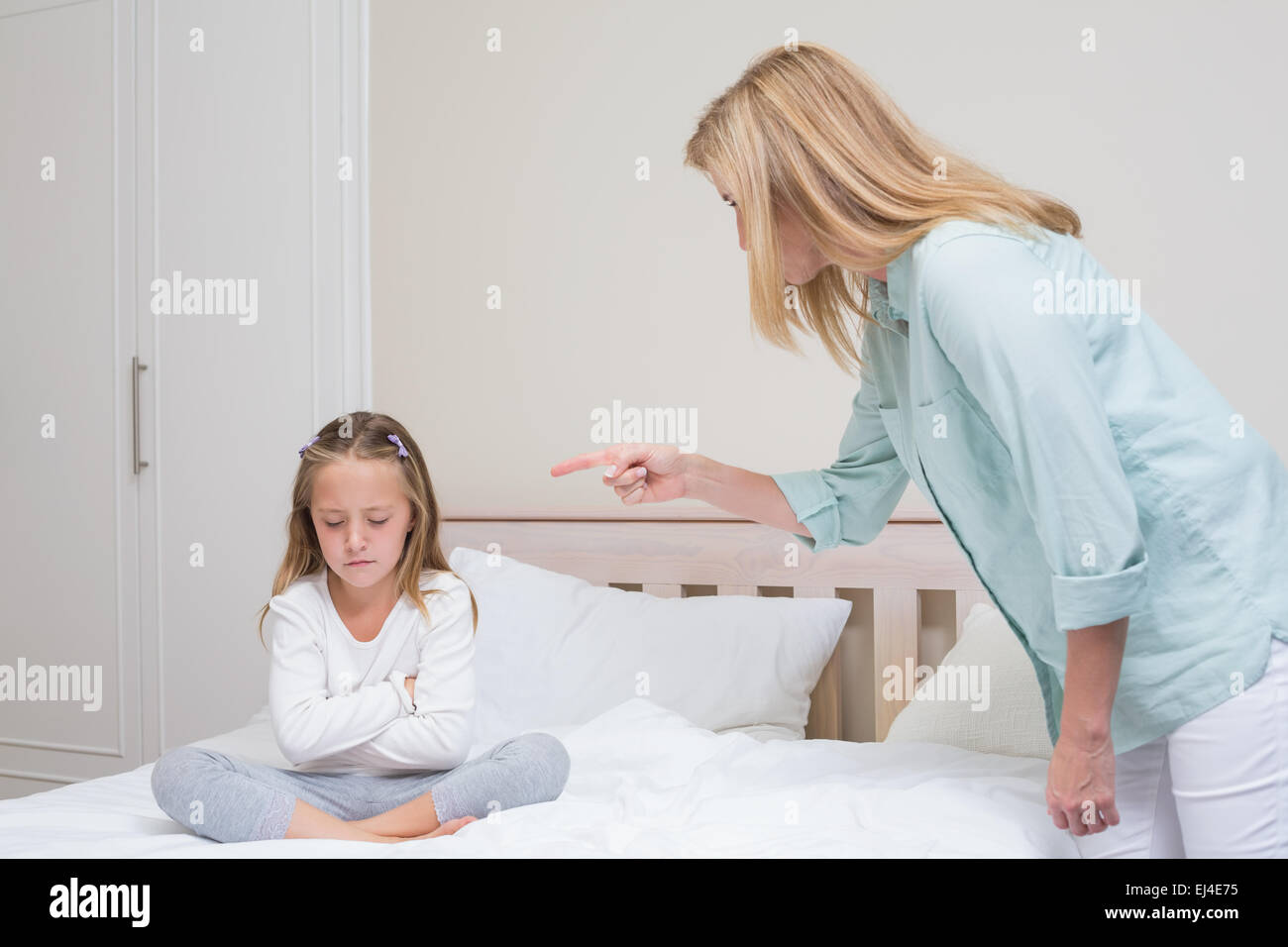 Upset mother scolding her daughter Stock Photo - Alamy