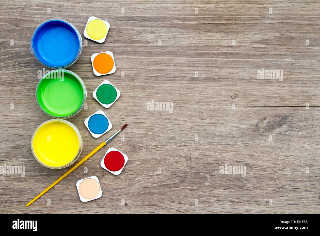 watercolors and tempera in wooden background Stock Photo - Alamy