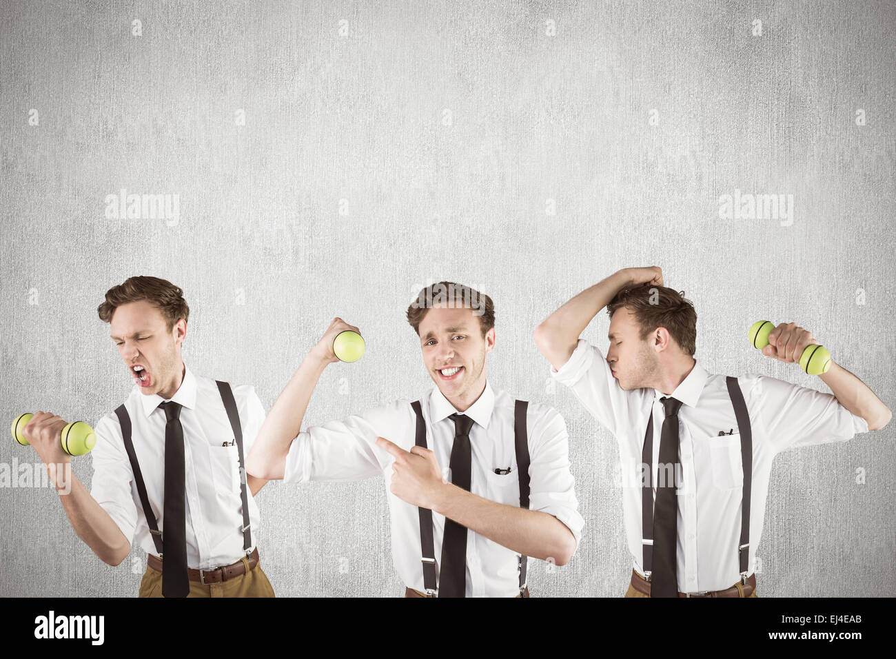 Composite image of nerd with dumbbell Stock Photo - Alamy