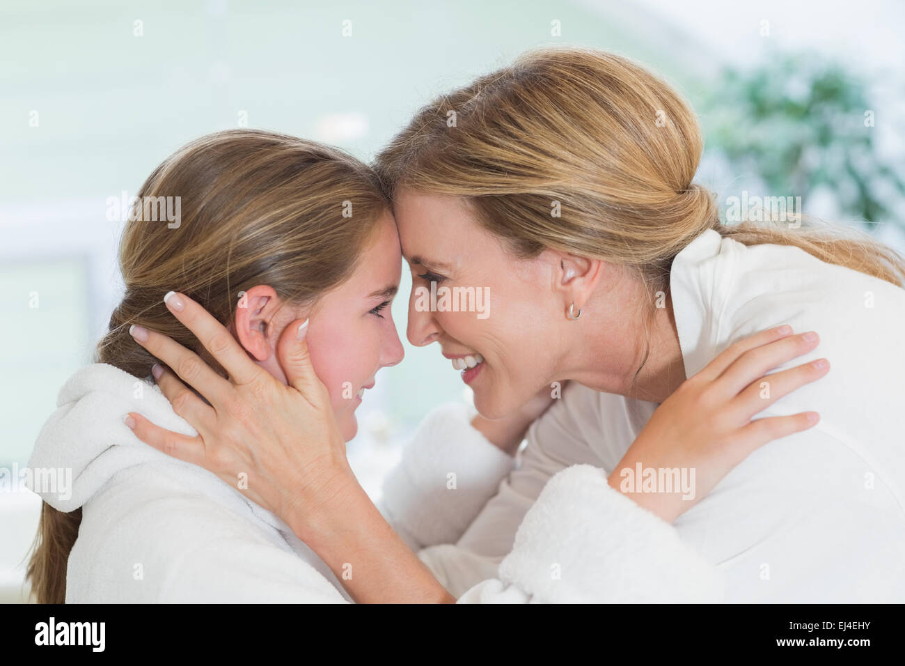 Happy mother and daughter hugging hi-res stock photography and images - Alamy