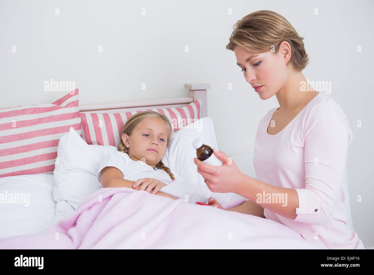Parent give child medicine hi-res stock photography and images - Alamy