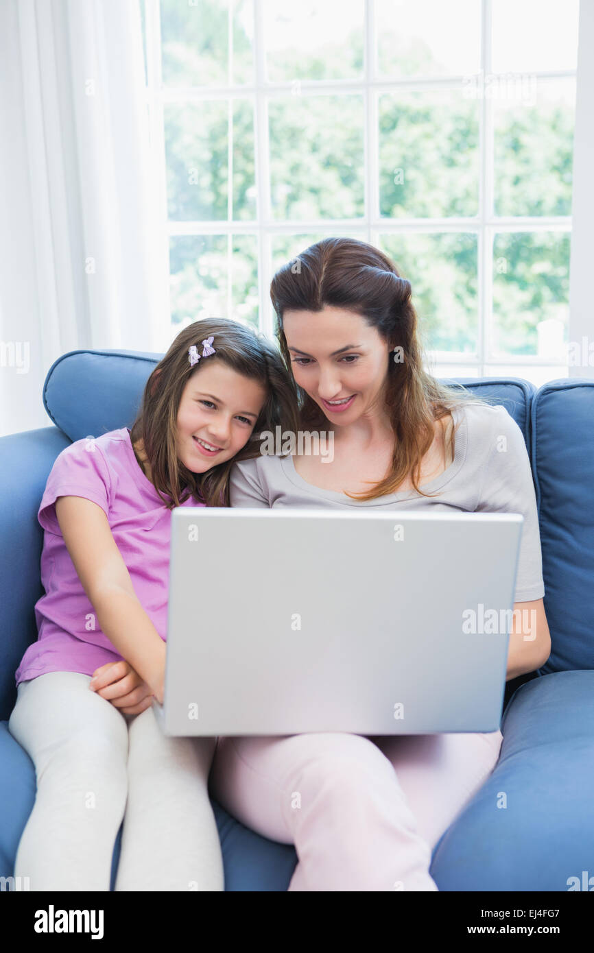 Mother and daughter using laptop Stock Photo - Alamy