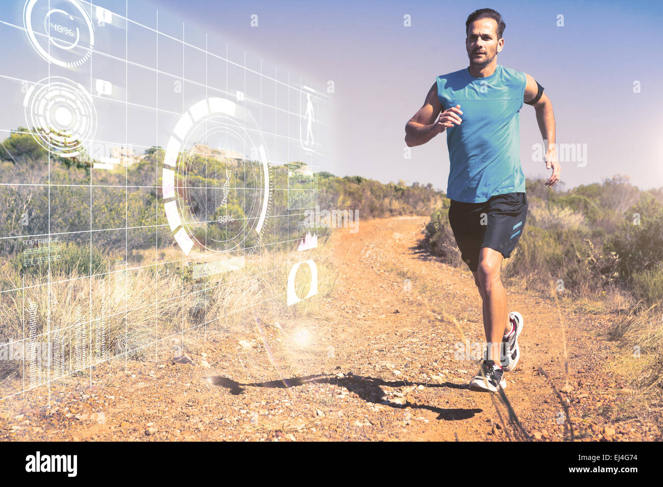 Composite image of athletic man jogging on country trail Stock Photo - Alamy