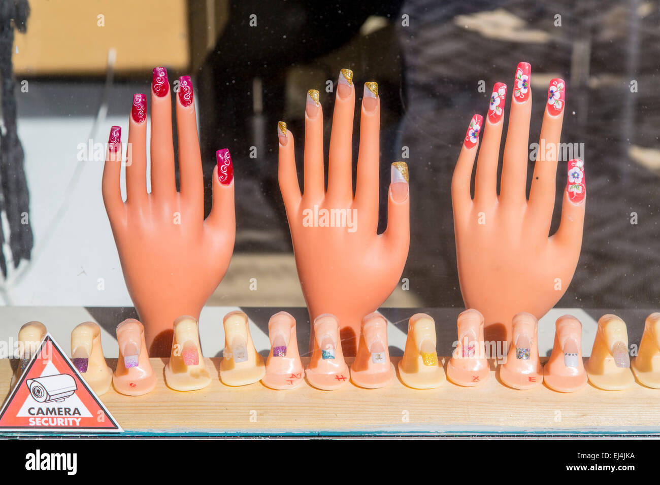 Showcase of a fingernail studio Stock Photo - Alamy