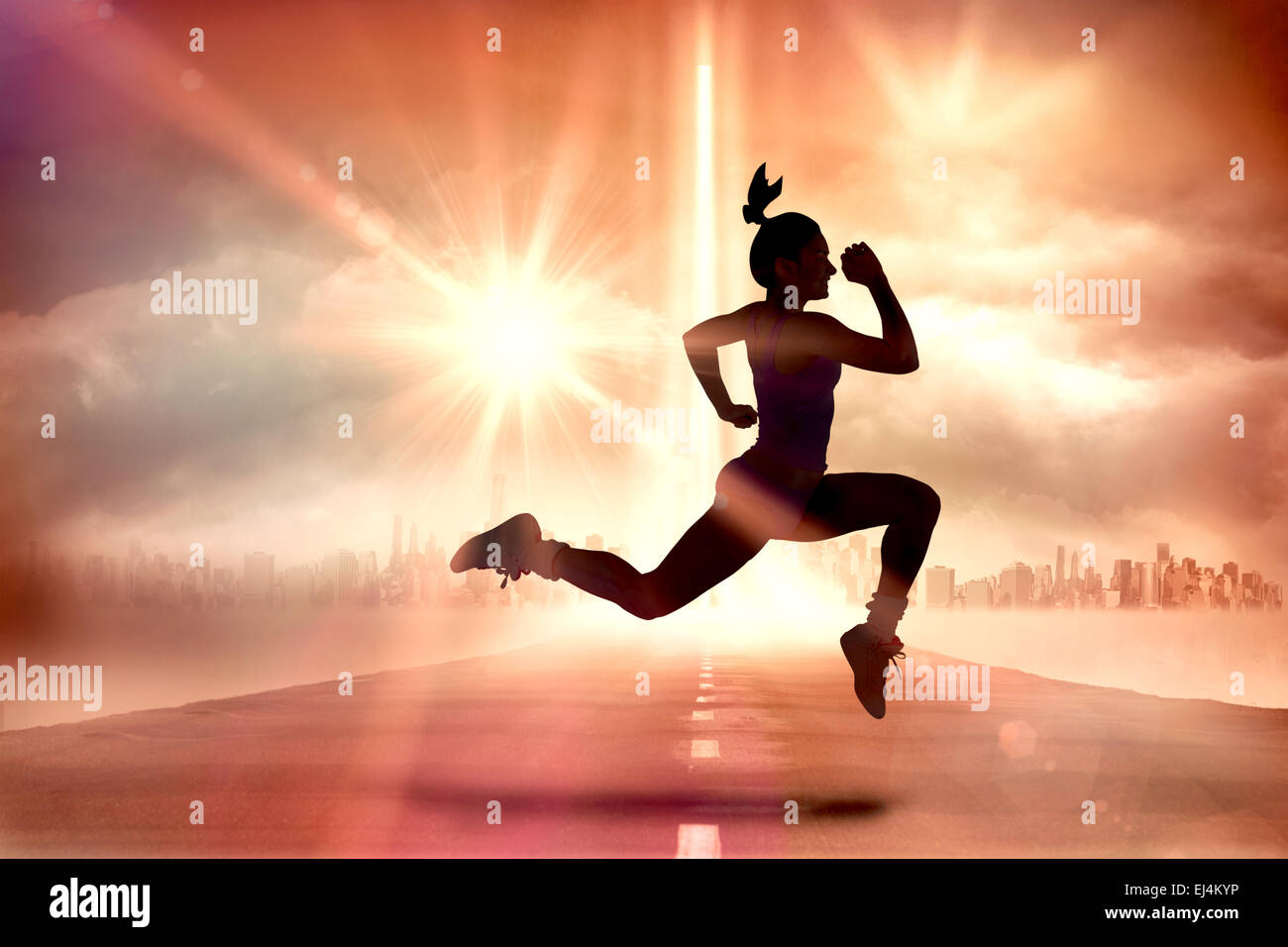 Composite image of fit brunette running and jumping Stock Photo - Alamy