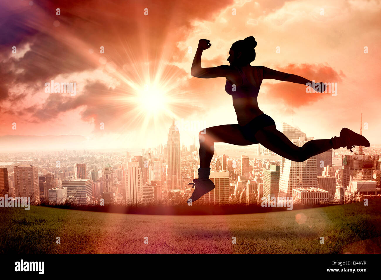 Composite image of fit brunette running and jumping Stock Photo - Alamy