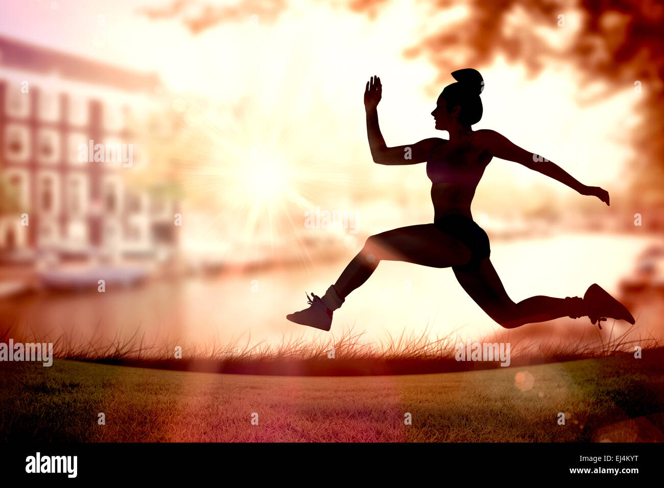 Composite image of fit brunette running and jumping Stock Photo - Alamy