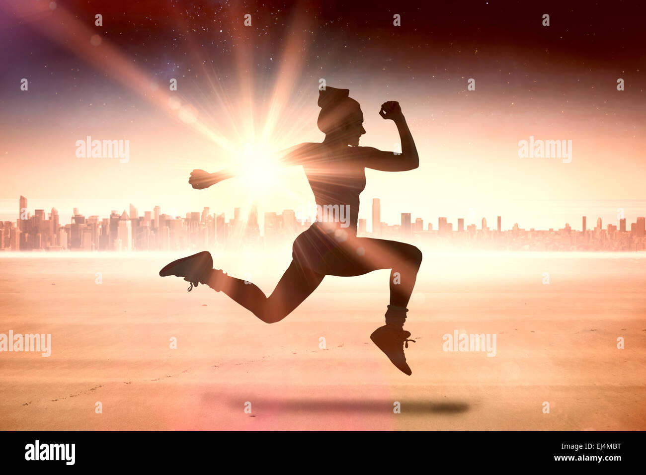 Composite image of fit brunette running and jumping Stock Photo - Alamy