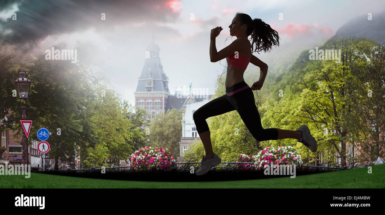 Composite image of full length of healthy woman jogging Stock Photo - Alamy