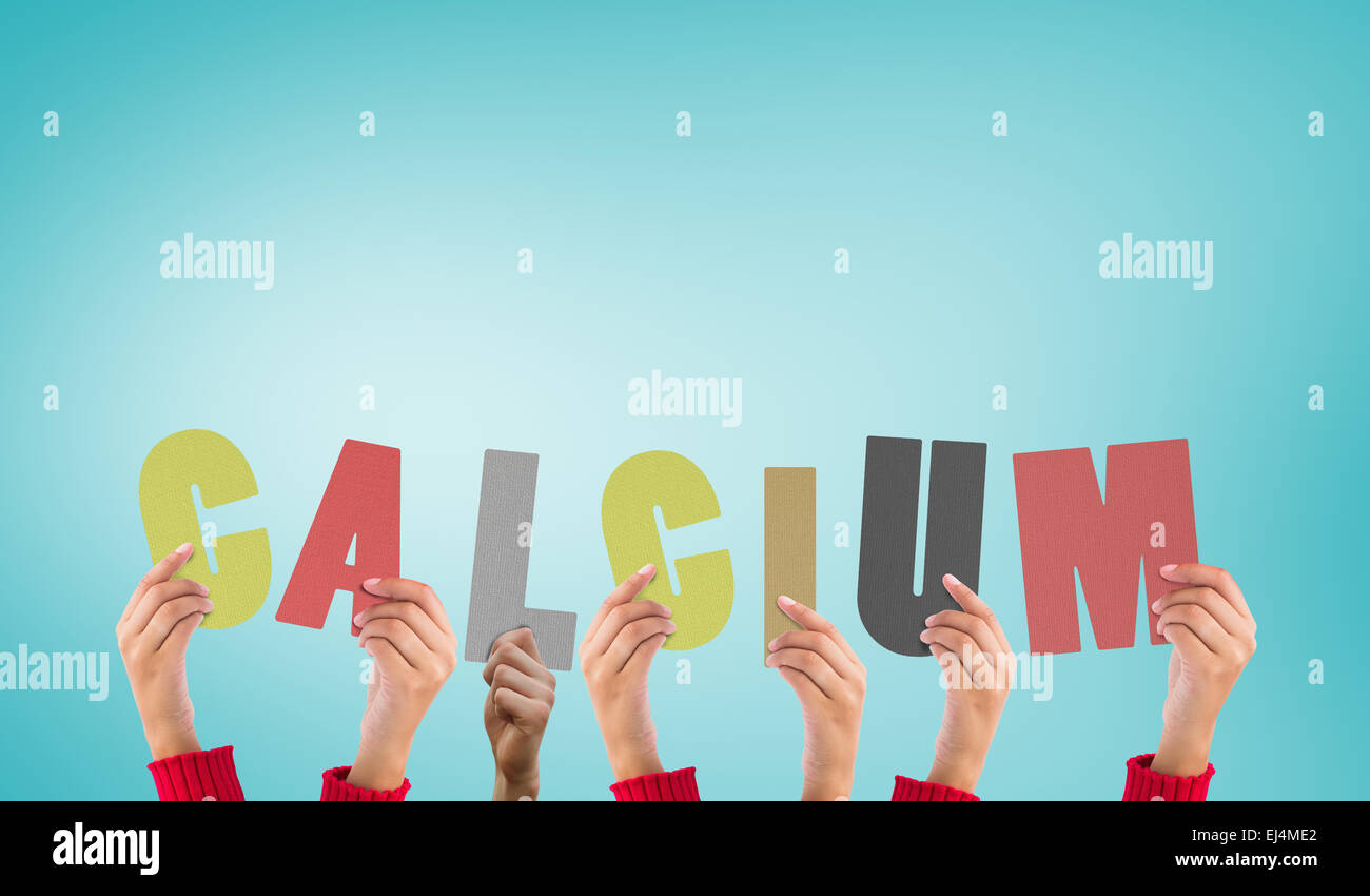 Composite image of hands holding up calcium Stock Photo - Alamy