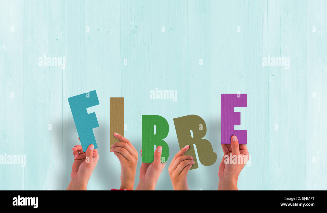 Composite image of hands holding up fibre Stock Photo - Alamy