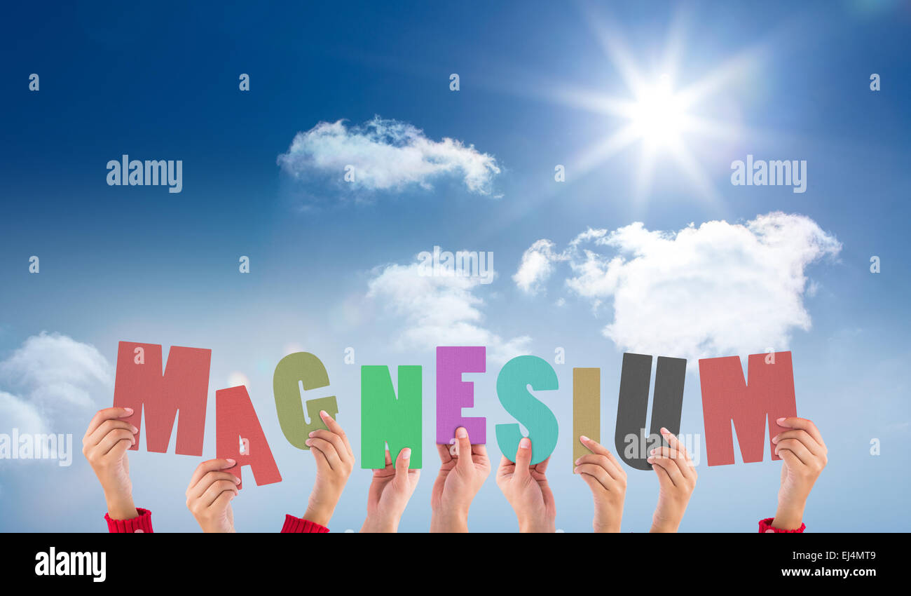 Composite image of hands holding up magnesium Stock Photo - Alamy