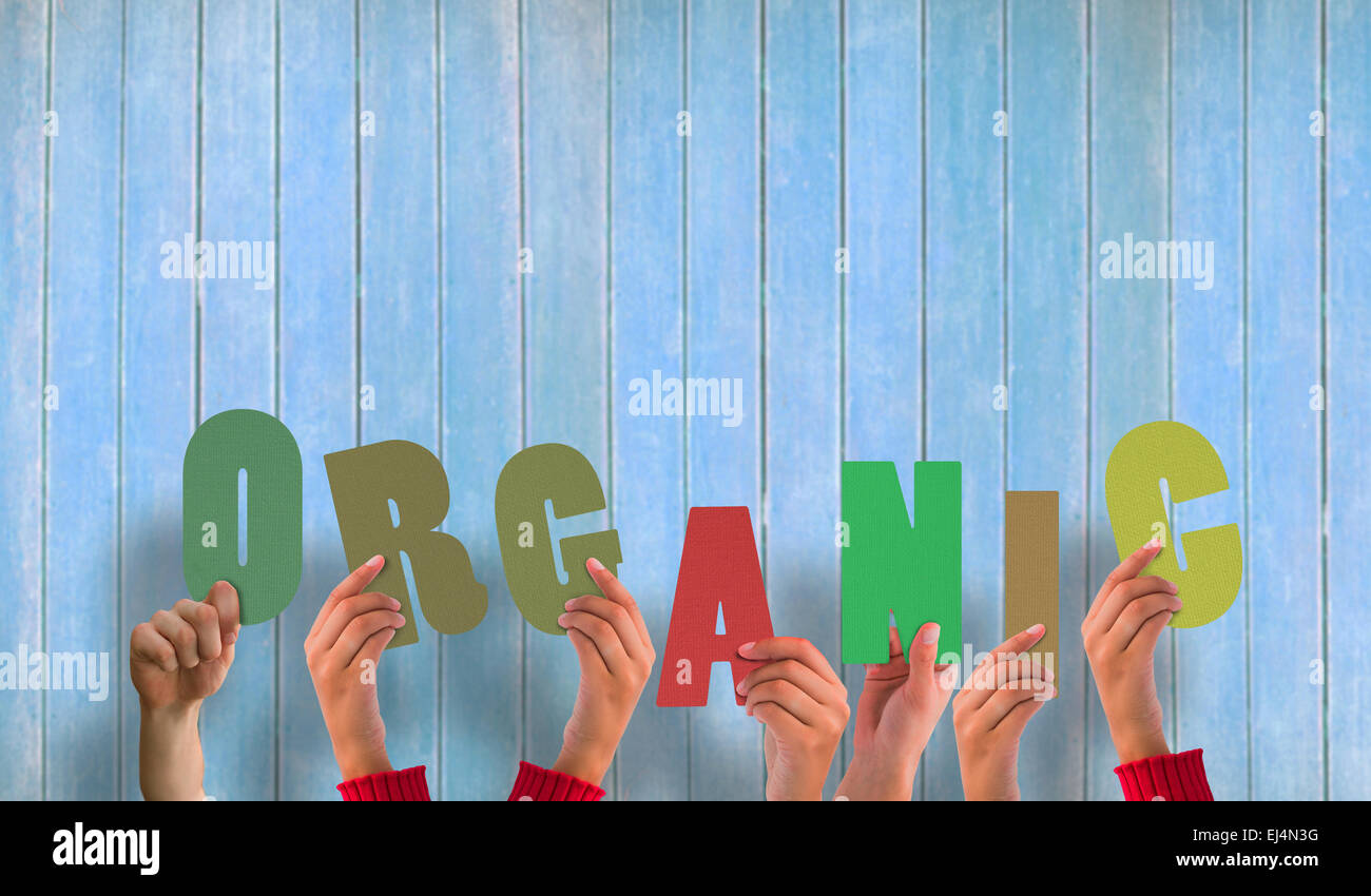 Composite image of hands holding up organic Stock Photo - Alamy