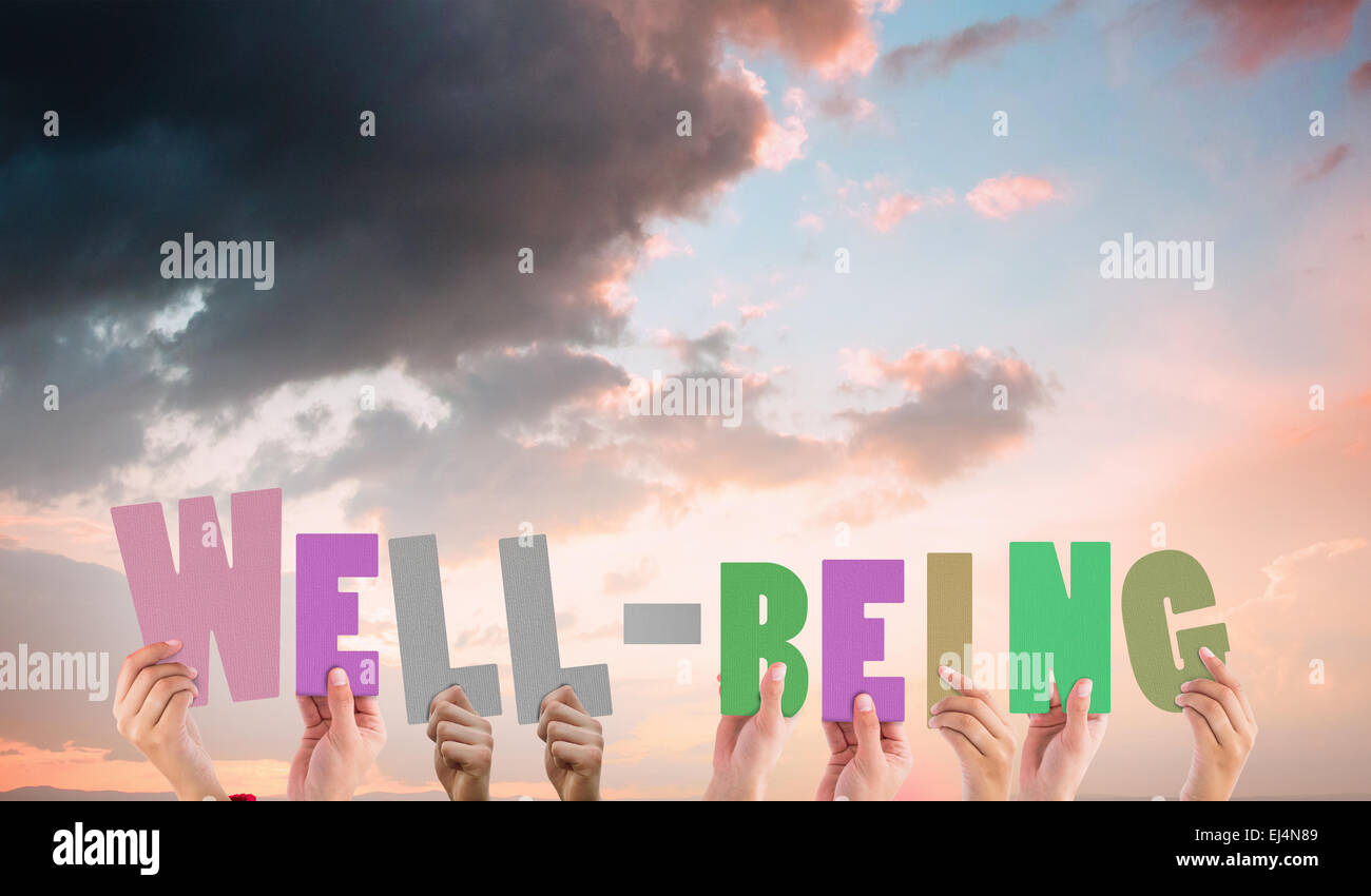 Composite image of hands holding up well being Stock Photo - Alamy