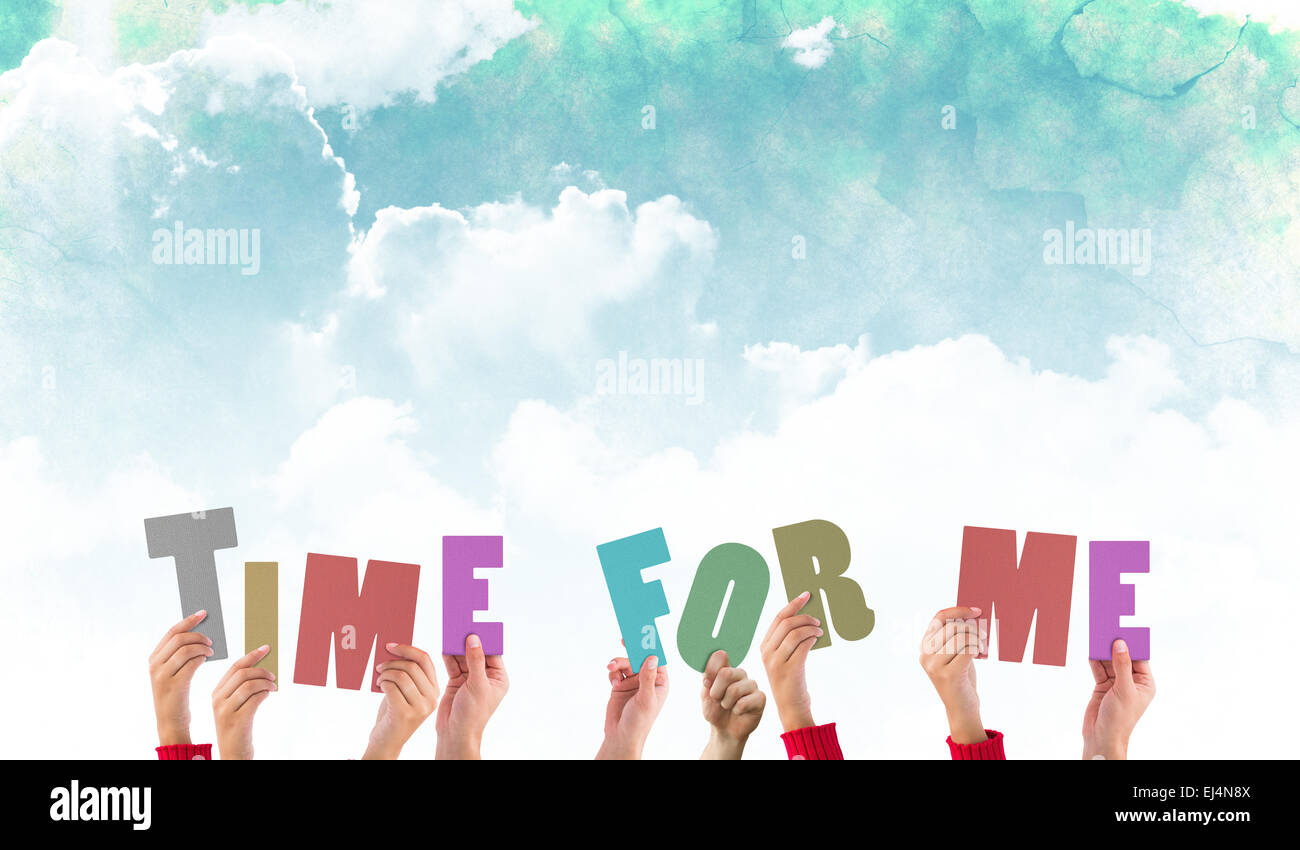 Composite image of hands holding up time for me Stock Photo - Alamy