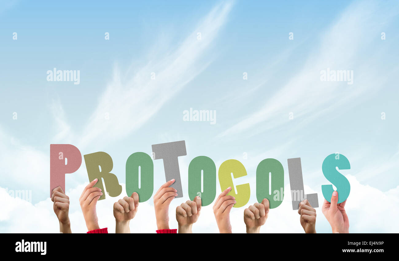 Composite image of hands holding up protocols Stock Photo - Alamy