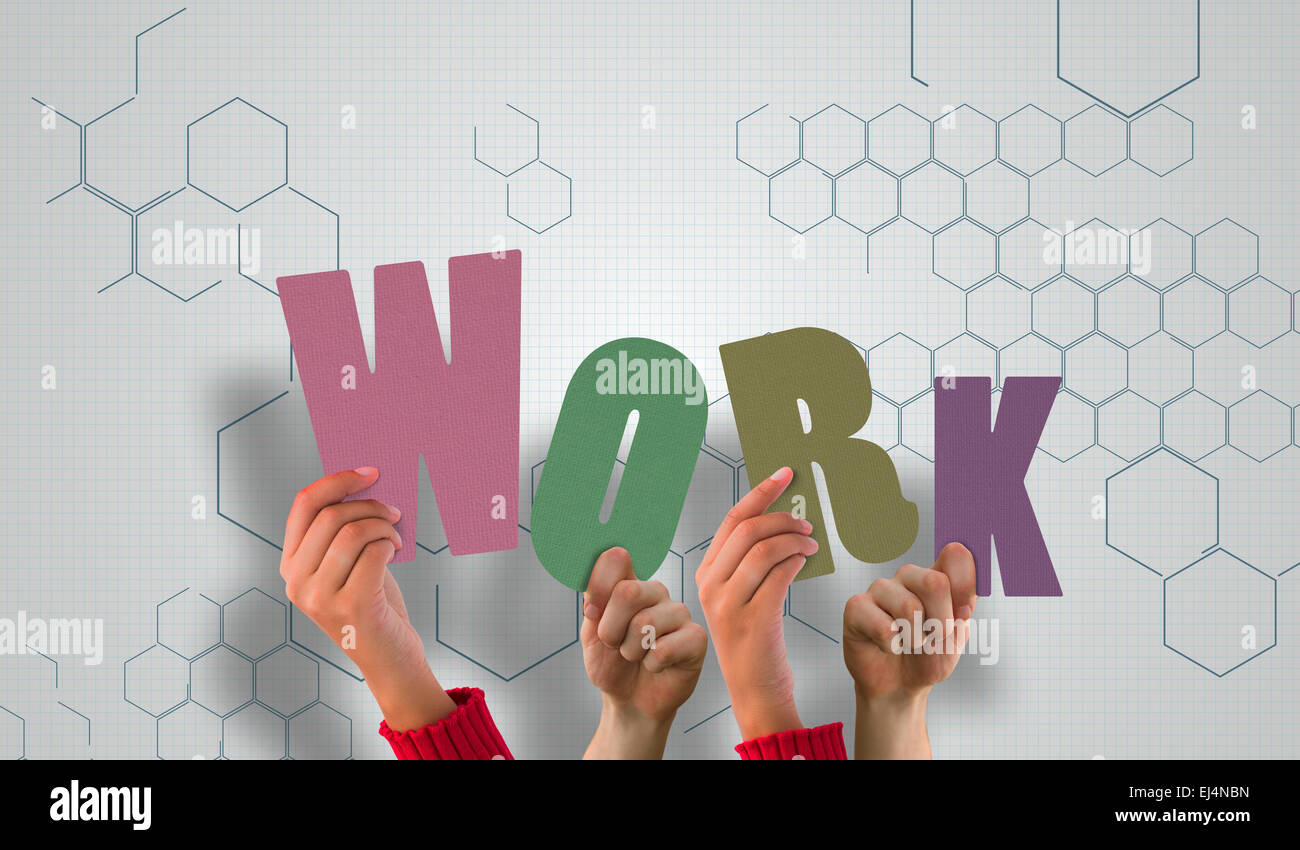 Composite image of hands holding up work Stock Photo - Alamy
