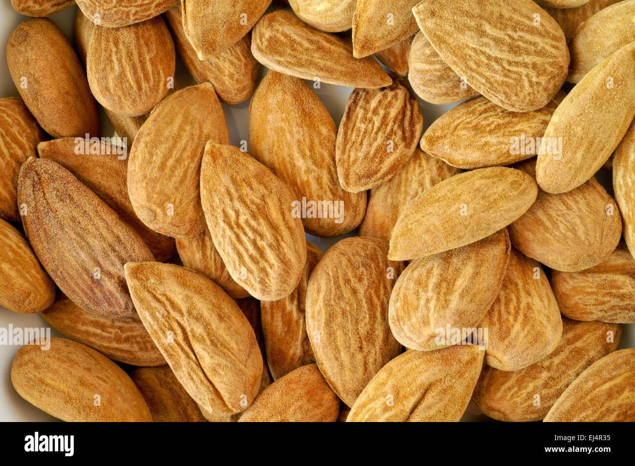 Almonds closeup background Stock Photo - Alamy