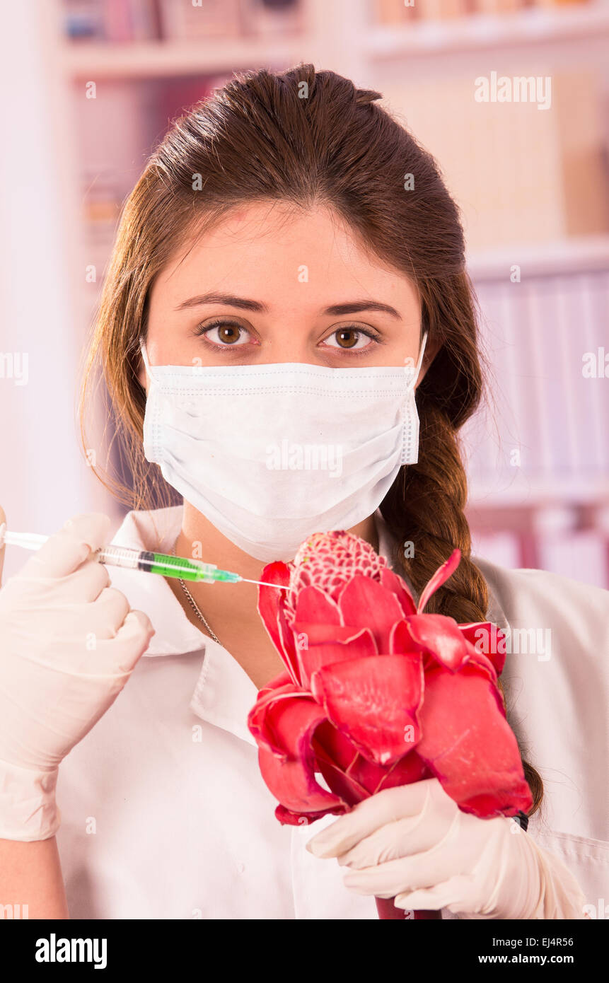 beautiful female biologist experimenting with red flower Stock Photo ...