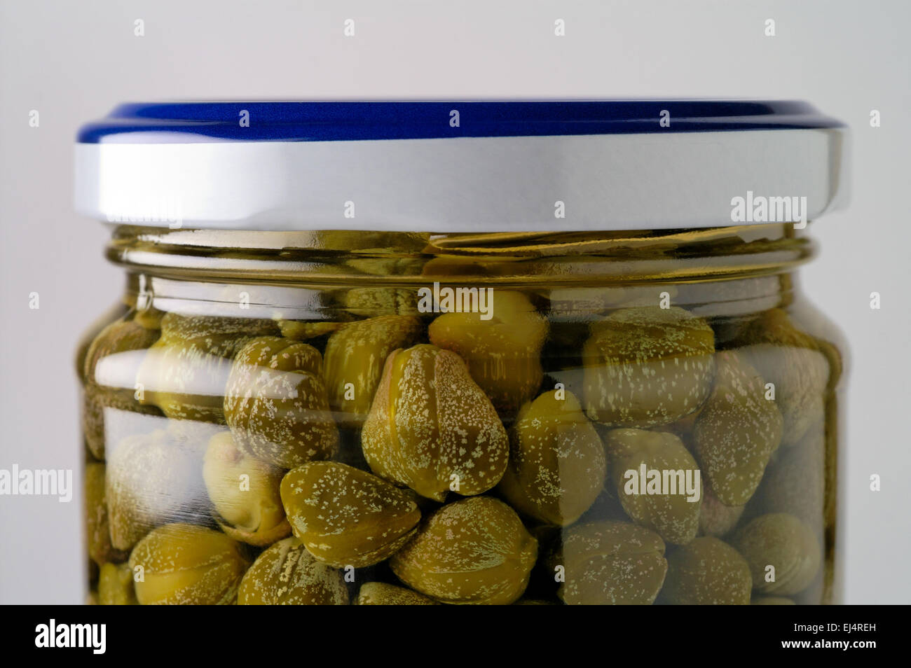 Glass jar of preserved capers with clipping path Stock Photo - Alamy
