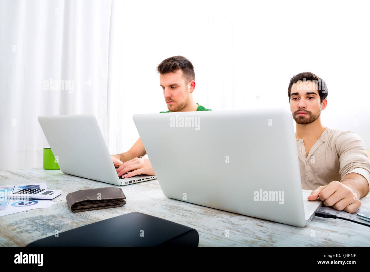 Two Friends starting up a company together Stock Photo - Alamy