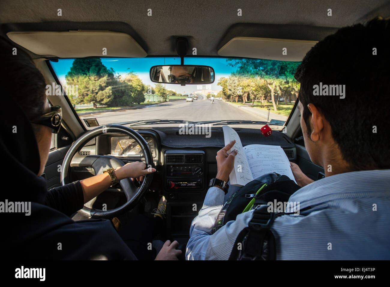 Bahor, Muslim women, drives car with his younger teenage brother Parsa ...