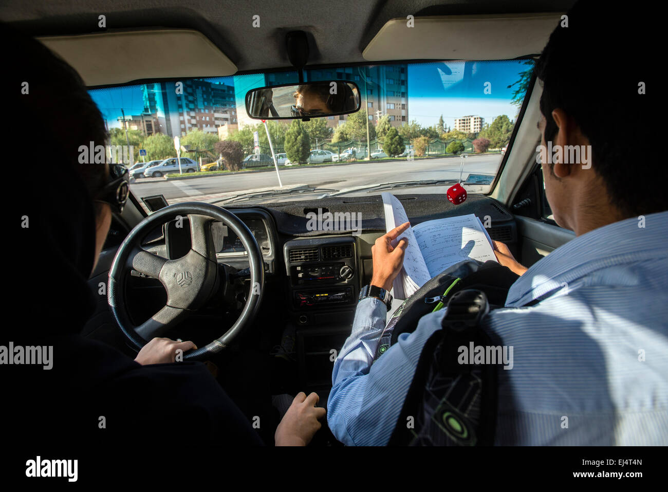 Bahor, Muslim women, drives car with his younger teenage brother Parsa ...