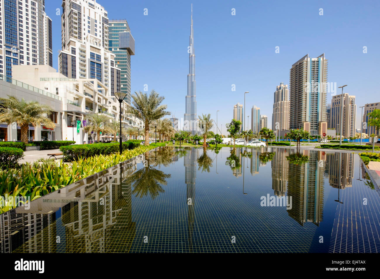 Burj Khalifa tower reflected in pond in Dubai United Arab Emirates ...