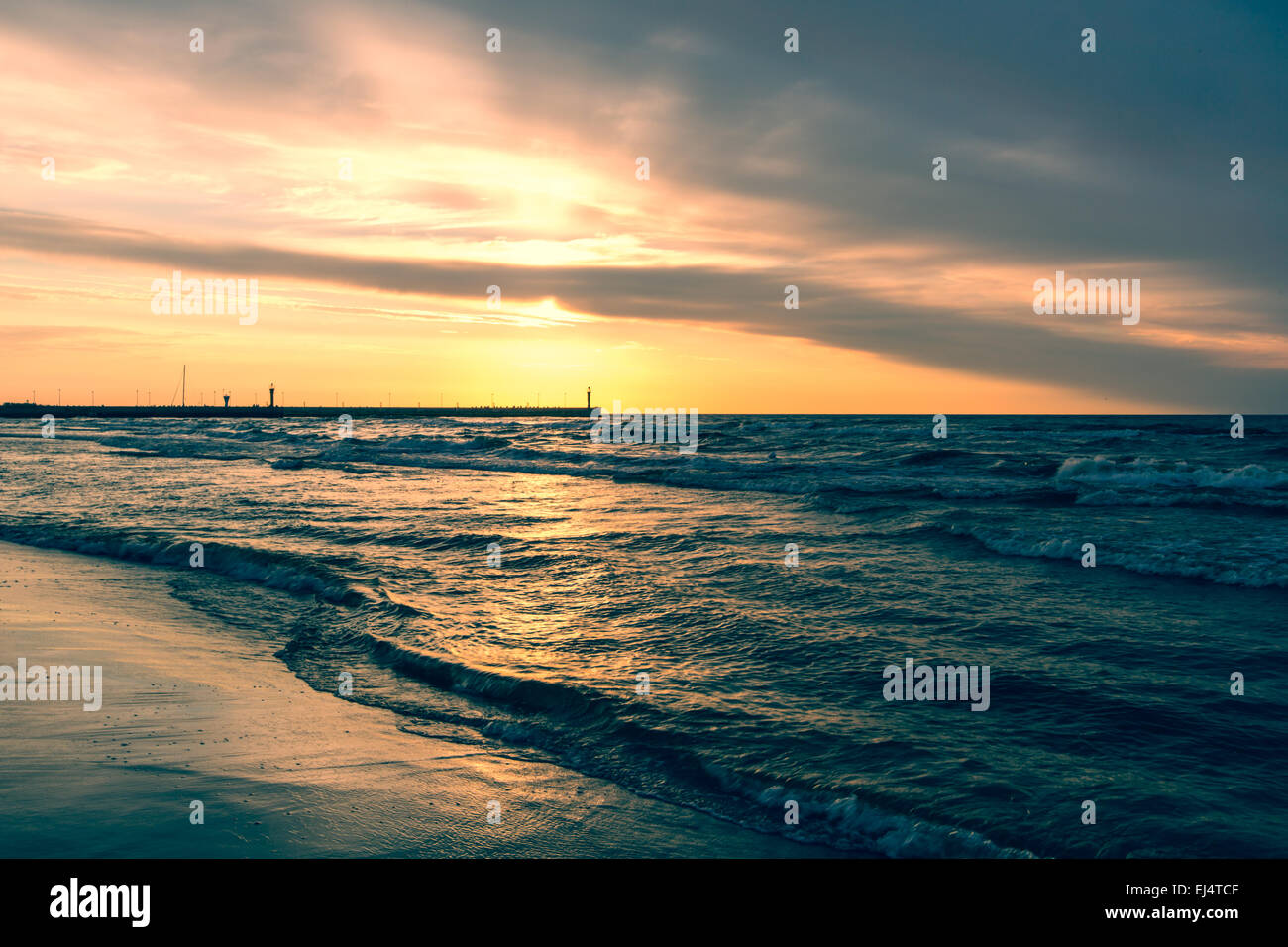 sunset on the beach Stock Photo - Alamy