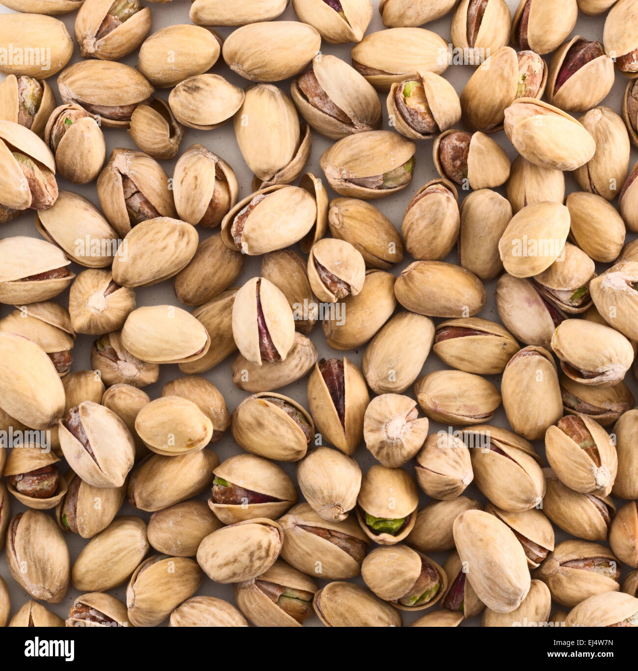 Pistachio covered surface background Stock Photo - Alamy