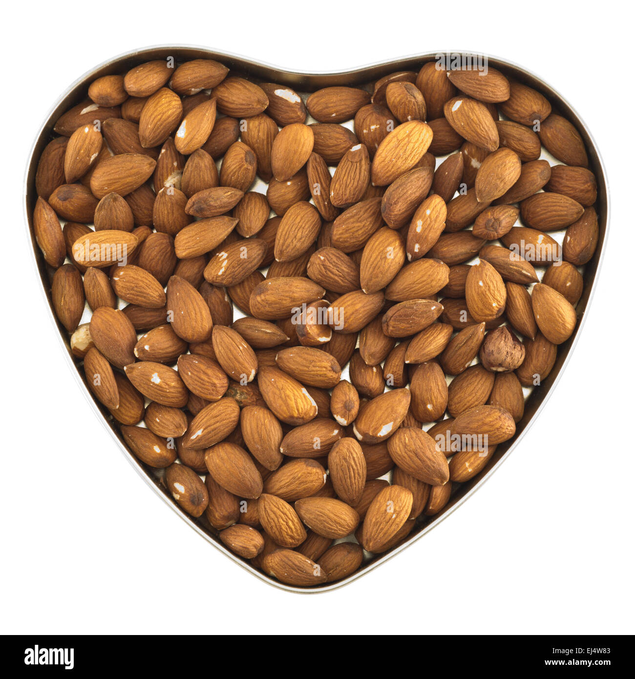 Heart shaped box full of almonds Stock Photo - Alamy