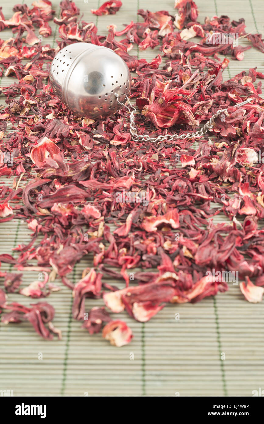 Tea infuser over red tea Stock Photo - Alamy