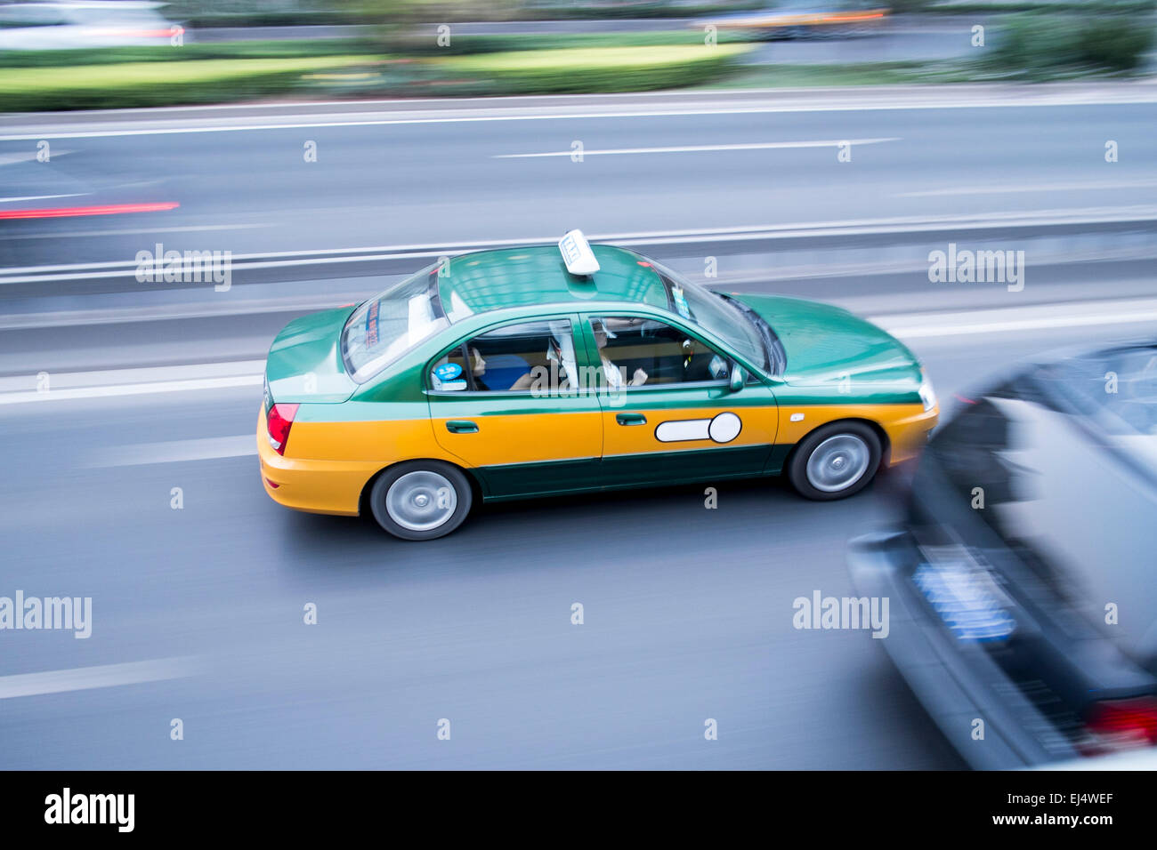 a driving taxi Stock Photo - Alamy