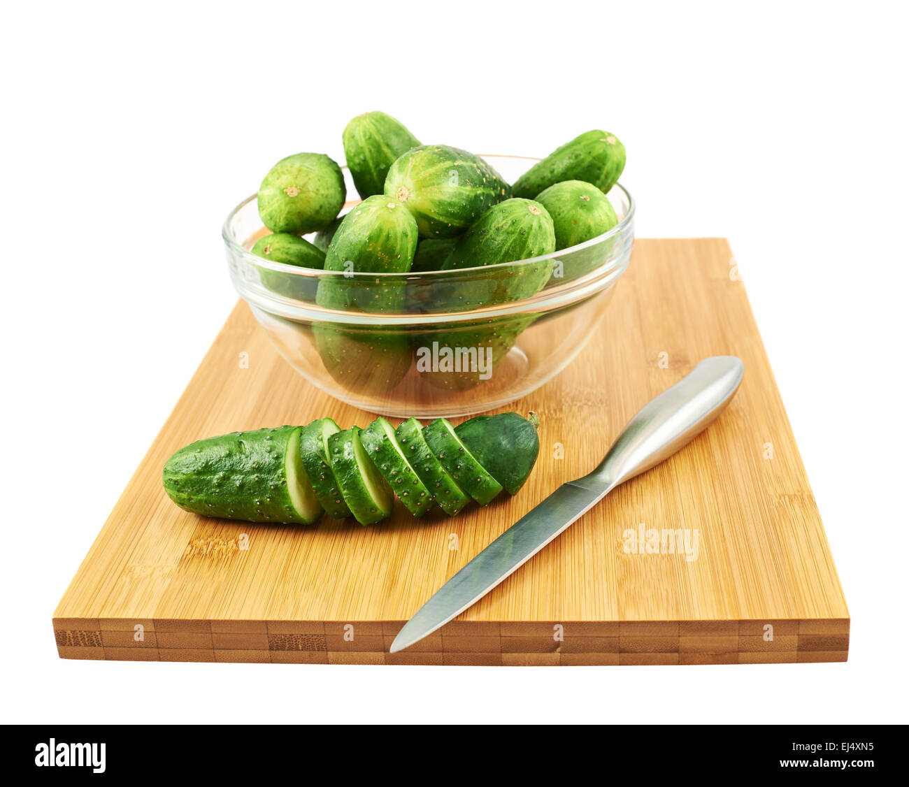 Slicing cucumber over a cutting board Stock Photo - Alamy