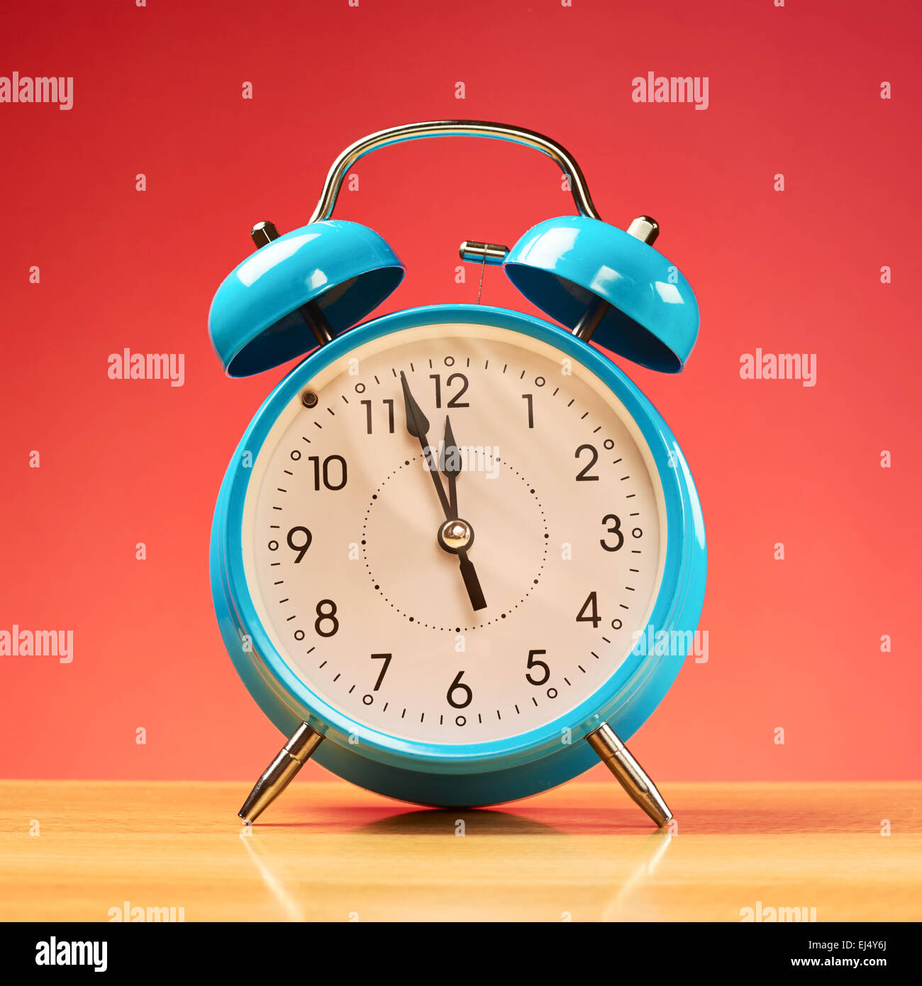 Blue alarm clock Stock Photo - Alamy