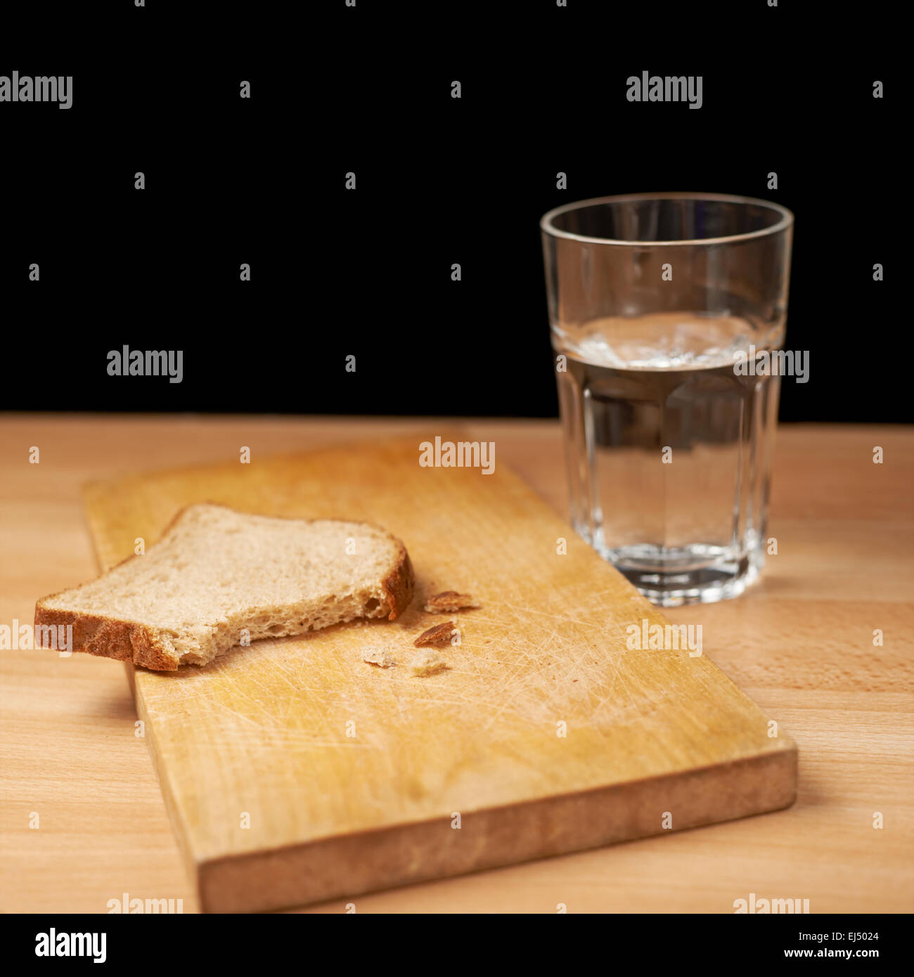 Glass of water and bread Stock Photo - Alamy