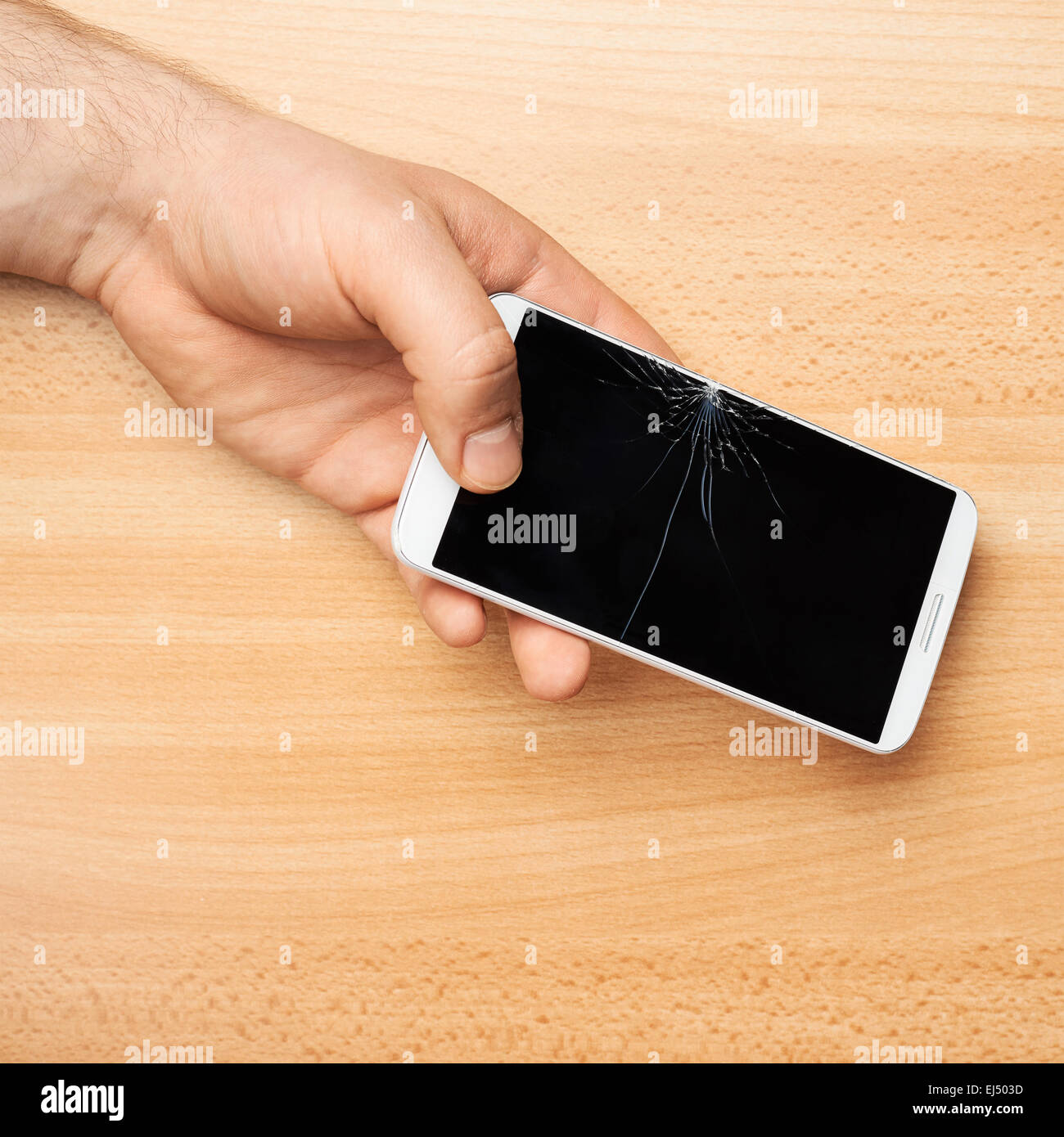 Hands holding a phone with a broken screen Stock Photo - Alamy