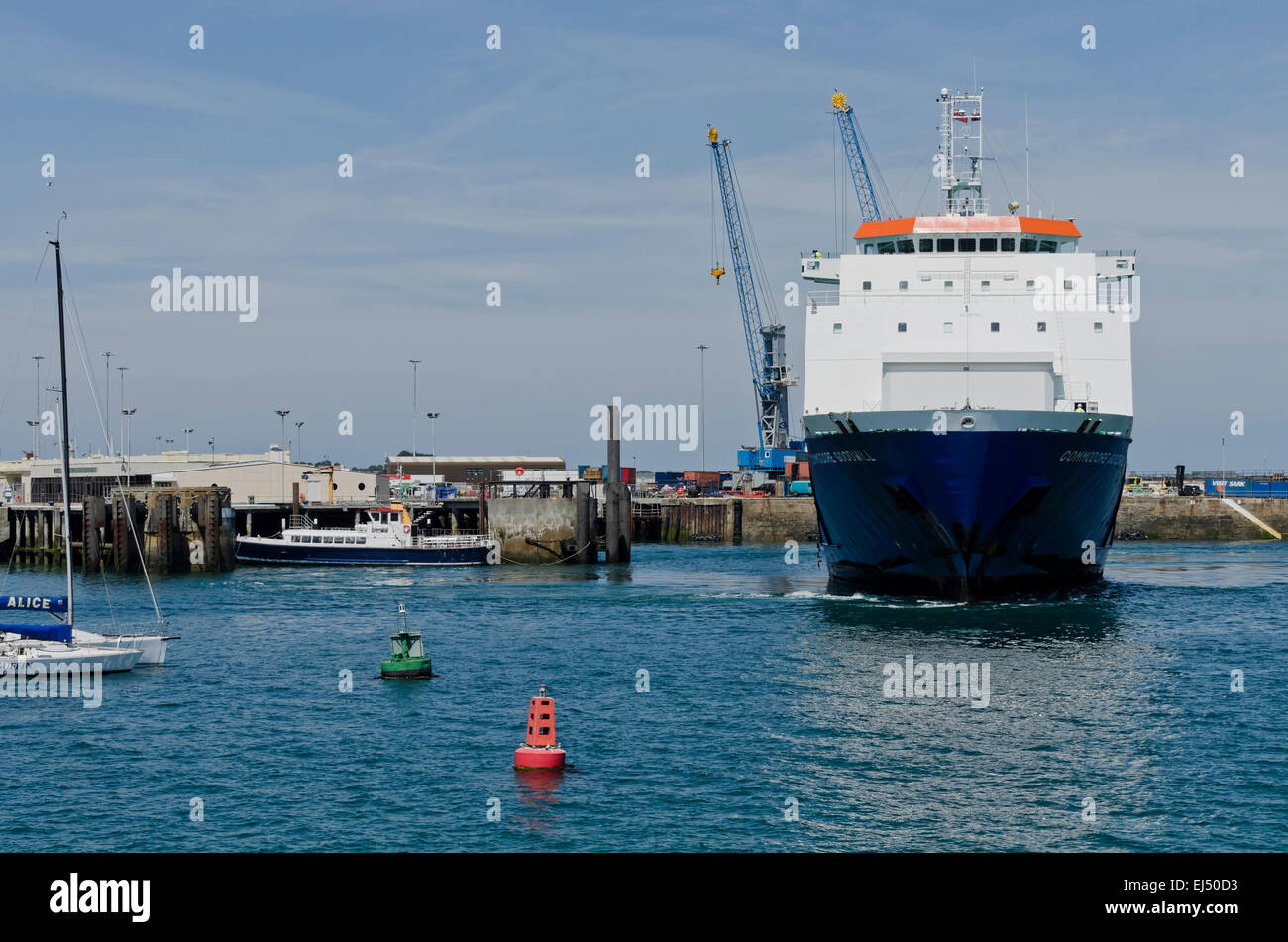 Passenger and cargo ship docking in St Peter Port Guernsey Stock Photo ...