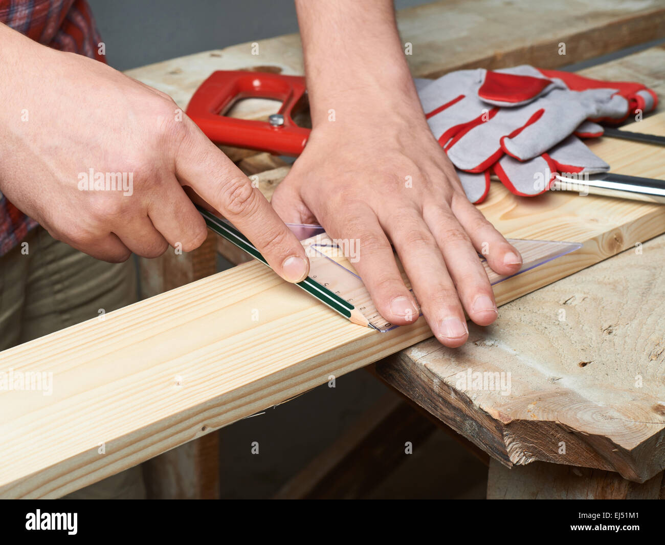 Marking the cutting line of the board Stock Photo - Alamy