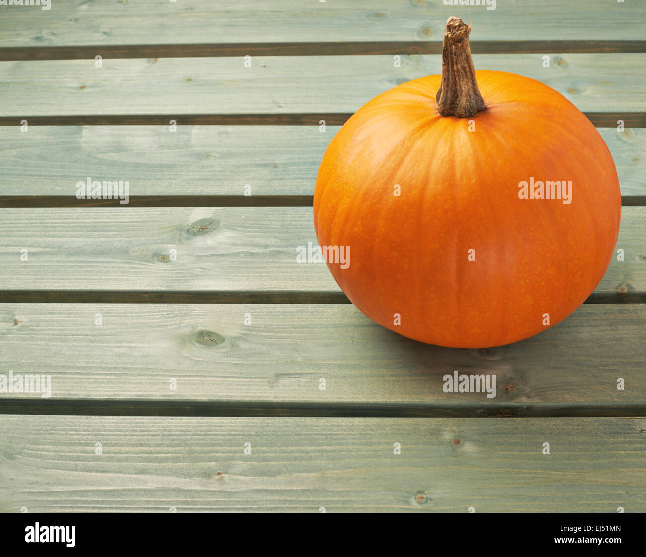Orange pumpkin over the wooden boards Stock Photo - Alamy