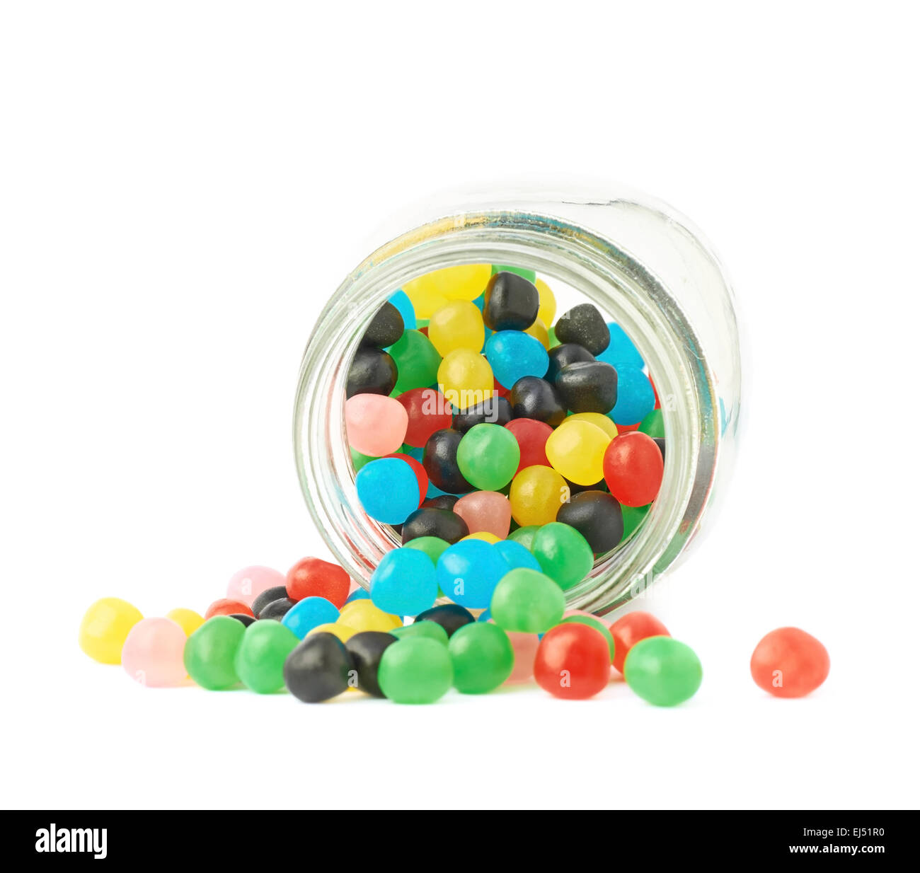 Candy ball sweets falling out of a jar Stock Photo - Alamy
