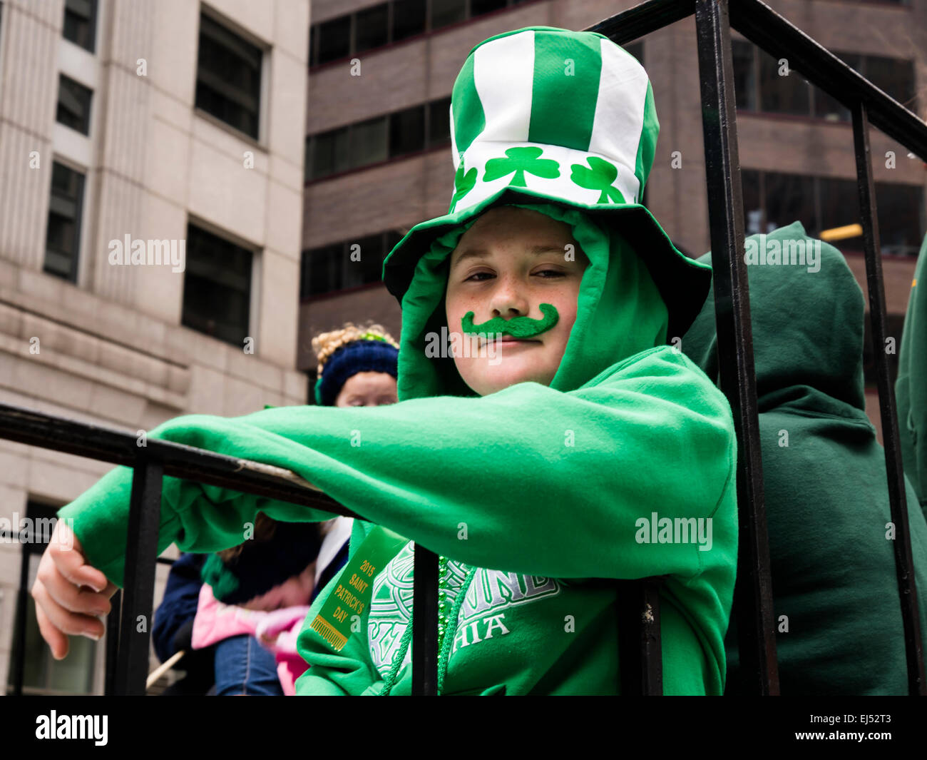 Boy in a bright green carnival costume, St. Patrick's Day Parade ...